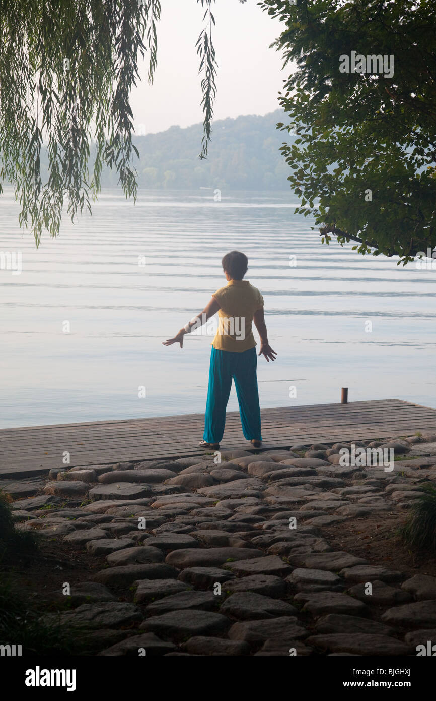 Woman doing morning exercise at Xi Hu, West Lake, Hangzhou, China Stock ...