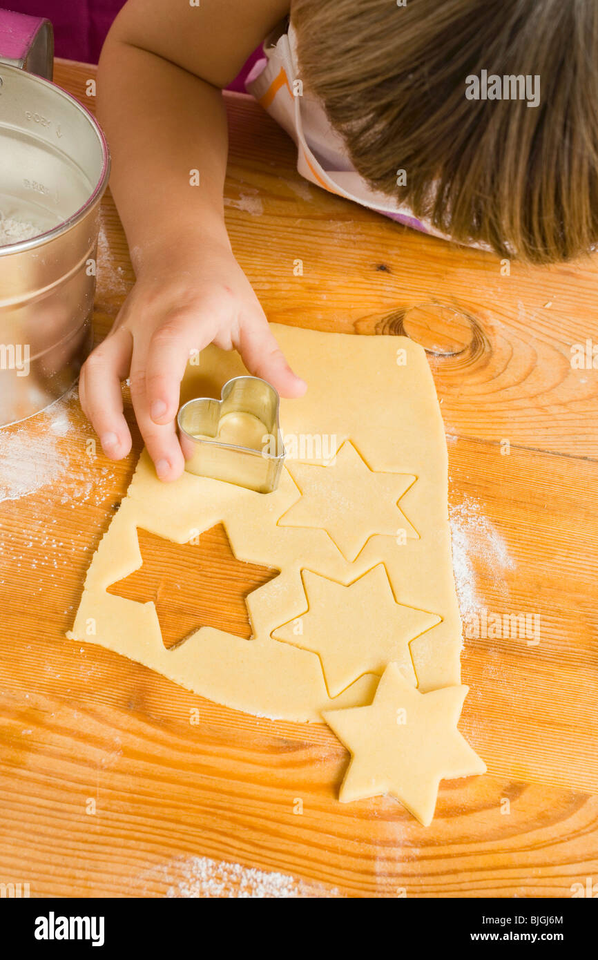 Child cutting out biscuits (overhead view Stock Photo - Alamy