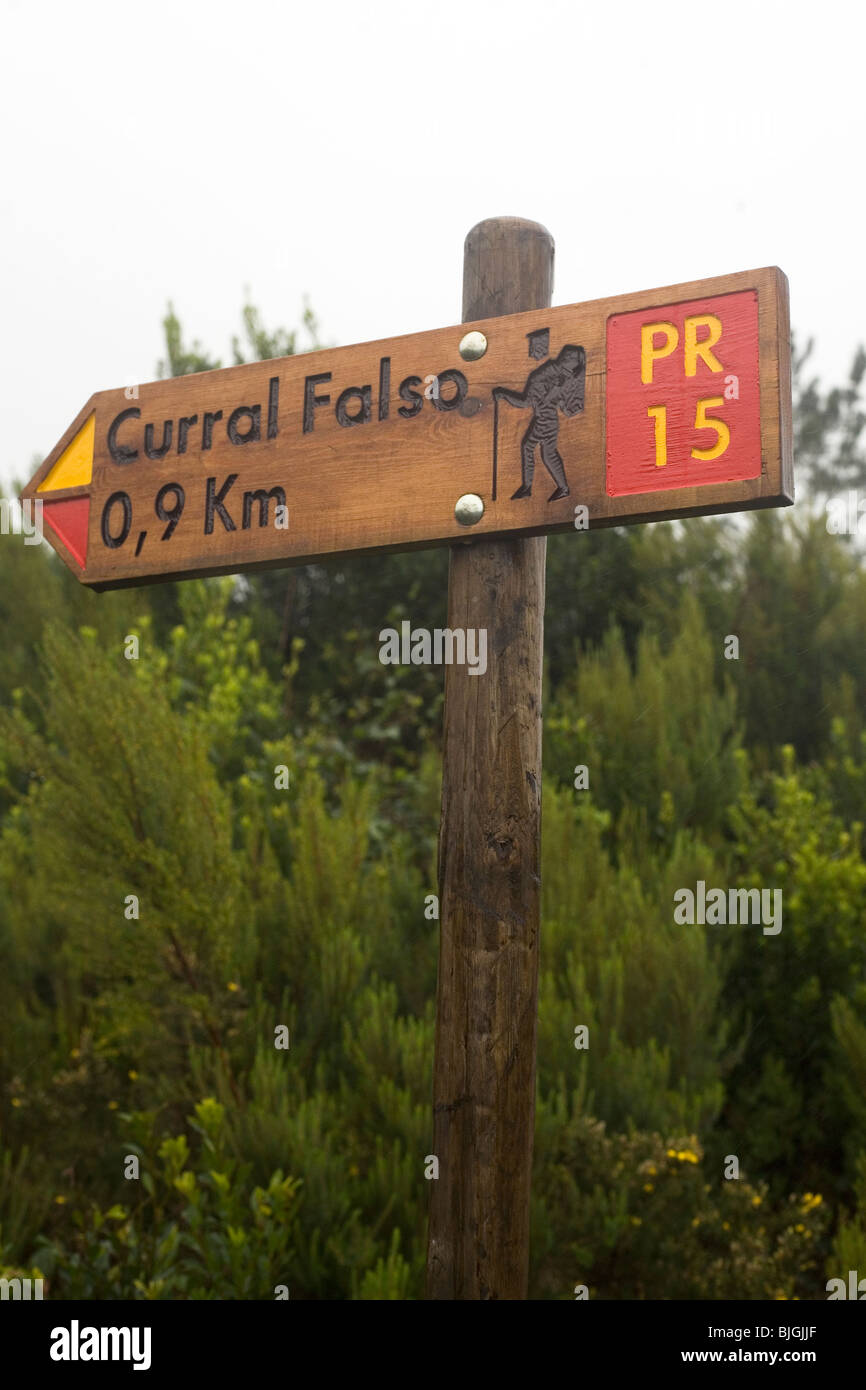 A sign points walkers along marked route PR15 on the island of Madeira ...
