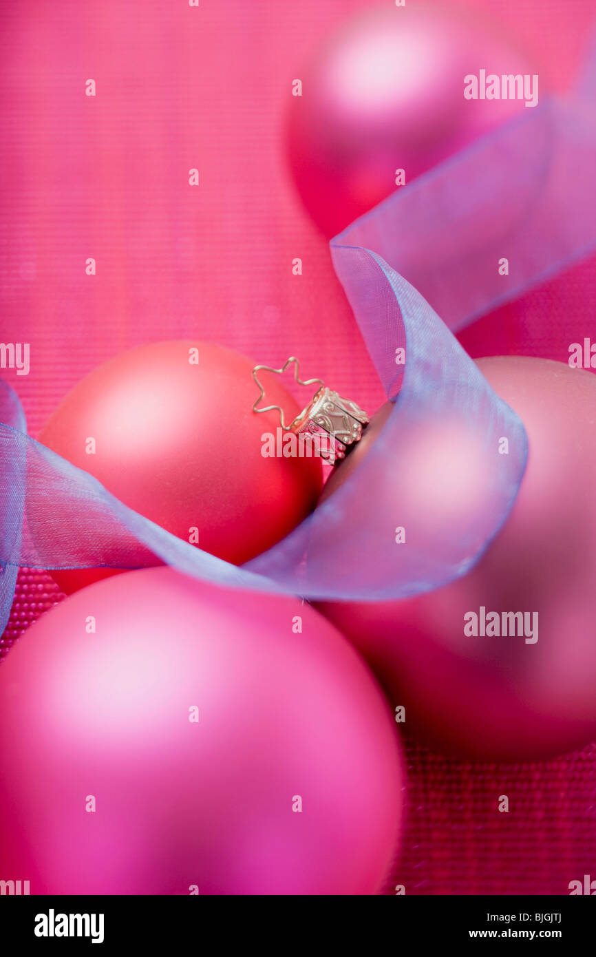 Pink Christmas baubles with blue ribbon Stock Photo - Alamy
