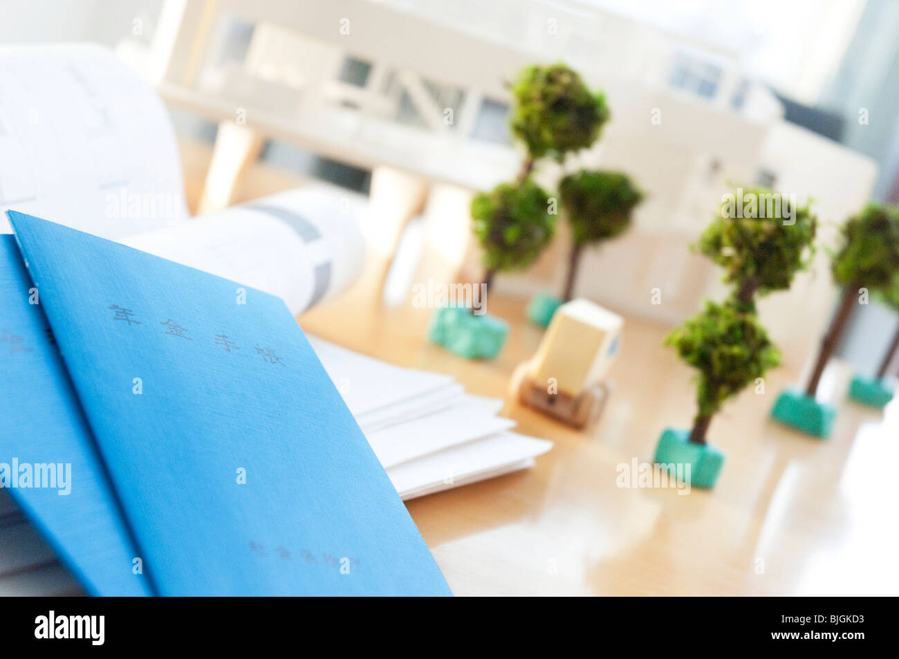 Pension booklet and model trees Stock Photo - Alamy