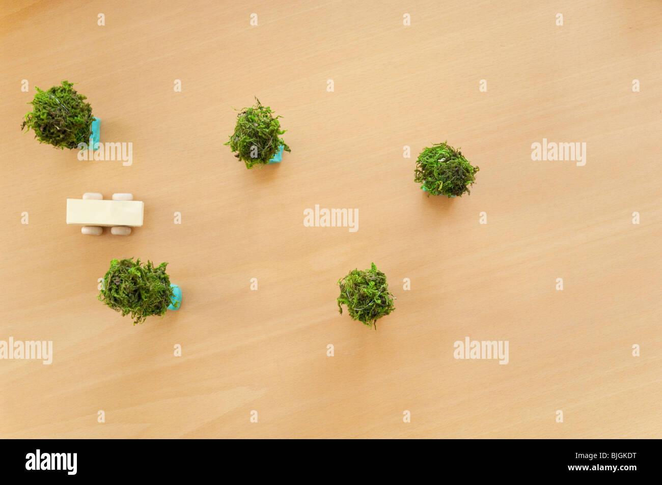Toy car and model trees Stock Photo - Alamy