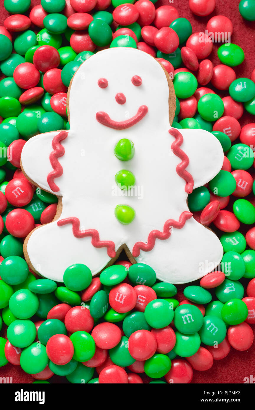 White gingerbread man on red and green chocolate beans Stock Photo - Alamy