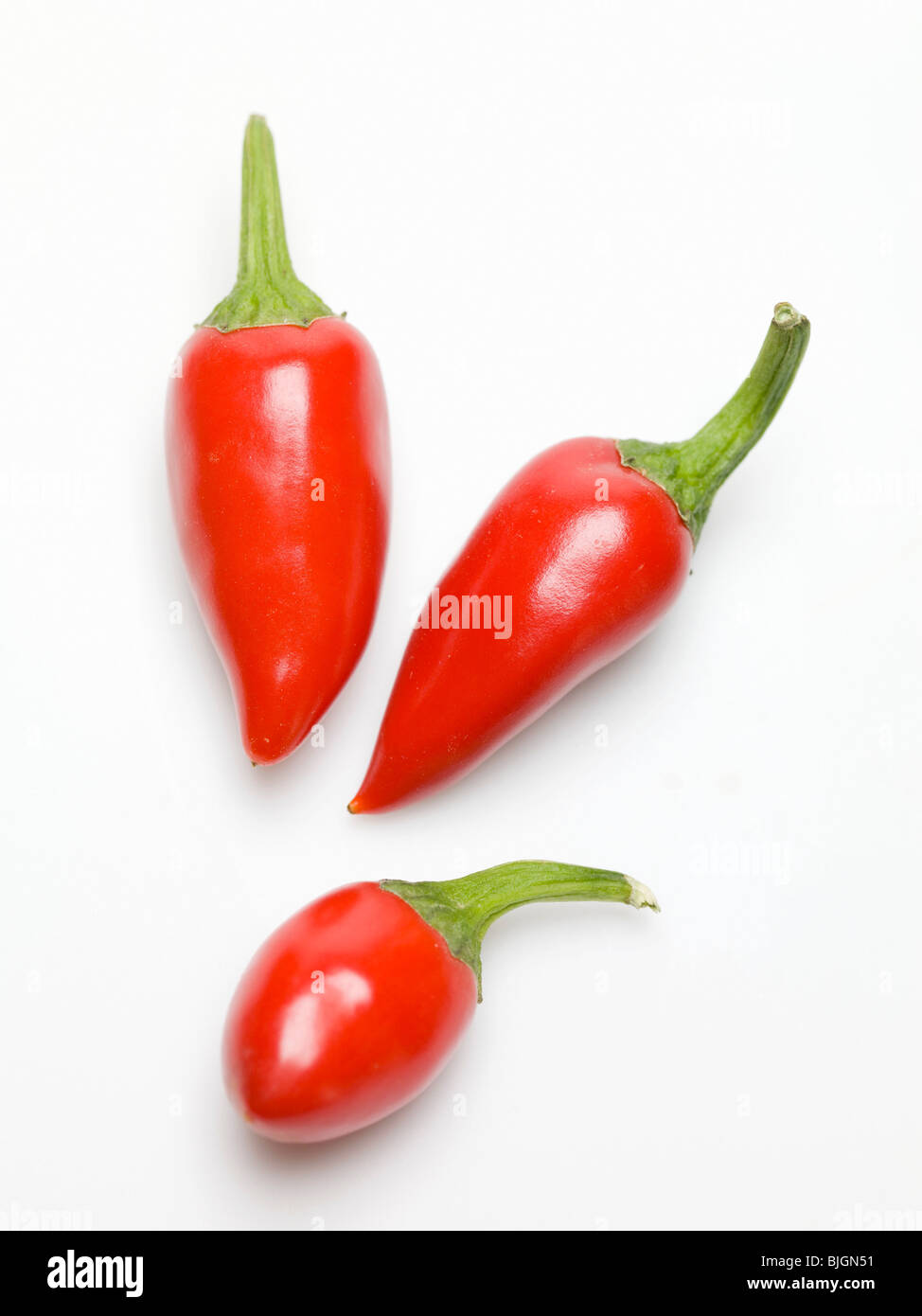 Three red chillies hi-res stock photography and images - Alamy