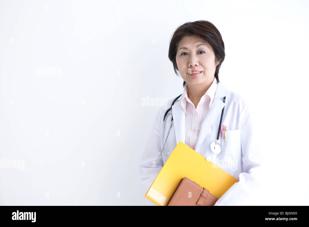 Doctor holding file Stock Photo - Alamy