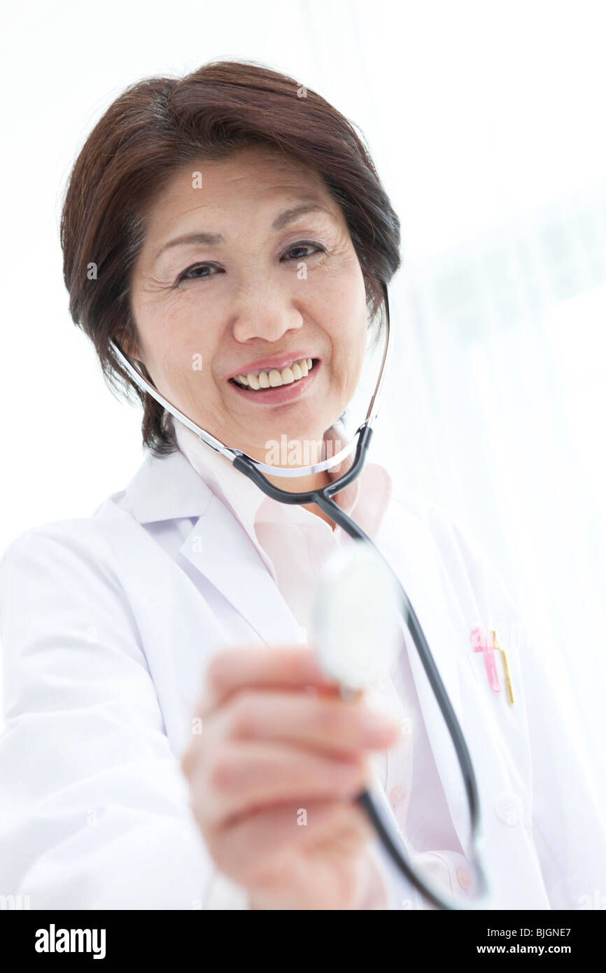 Cheerful doctor with stethoscope Stock Photo - Alamy