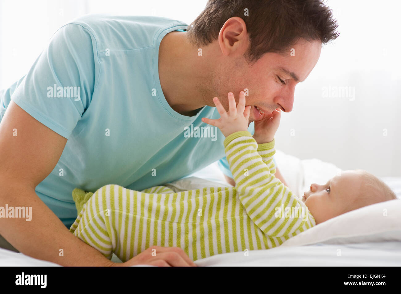 Father and baby playing Stock Photo - Alamy