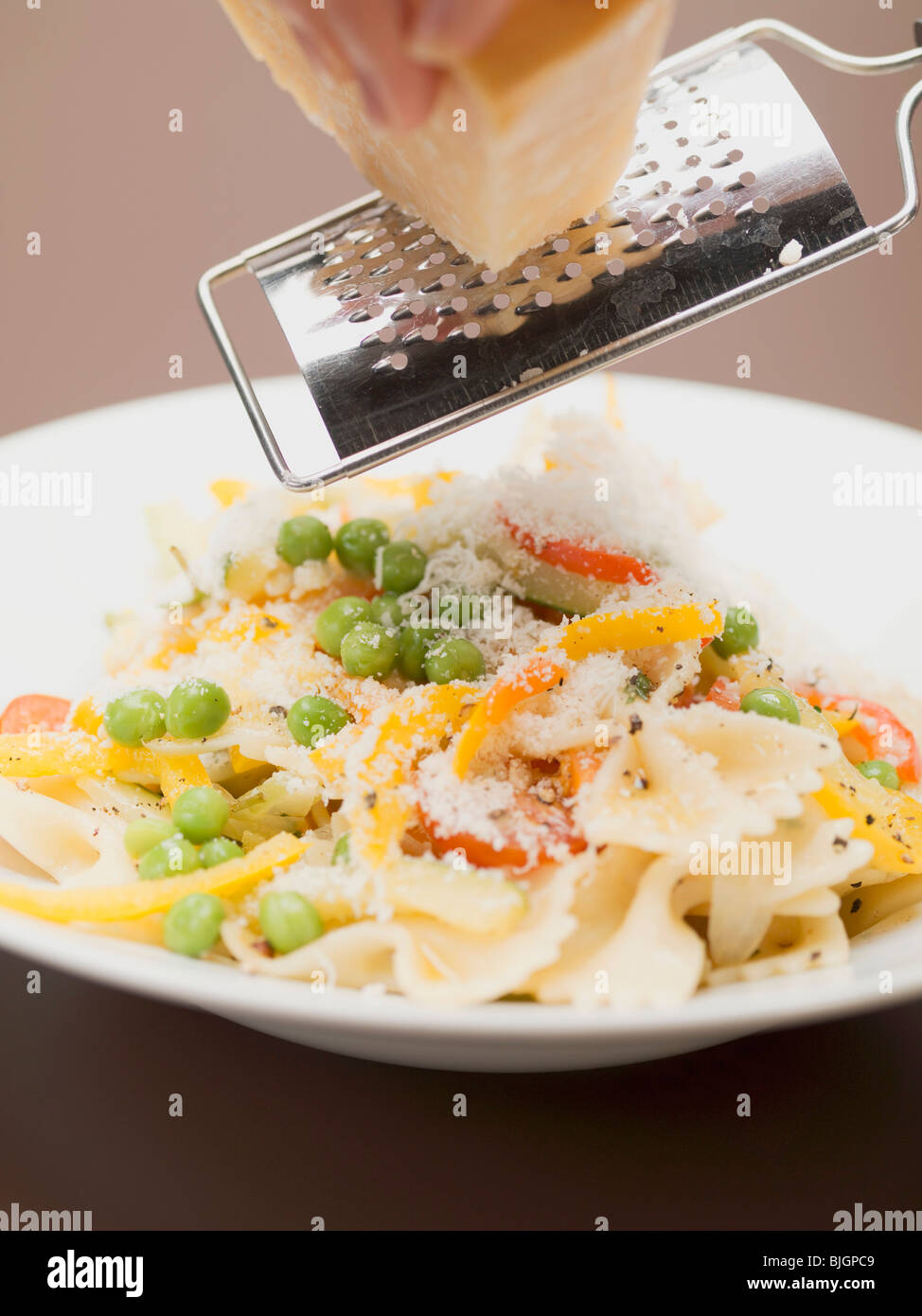 Grating parmesan hi-res stock photography and images - Alamy
