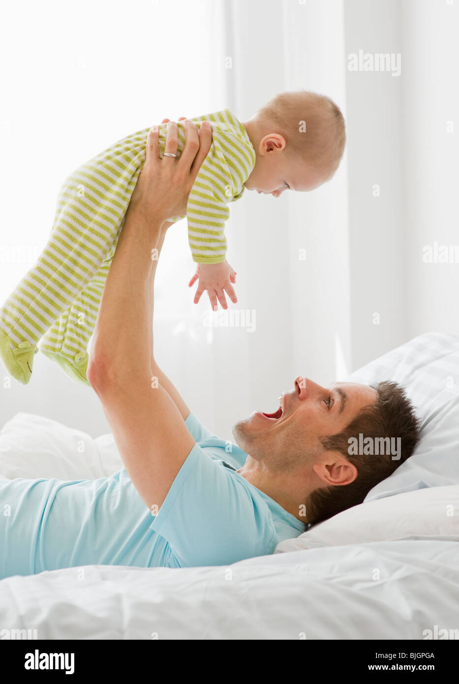 Father and baby playing Stock Photo - Alamy