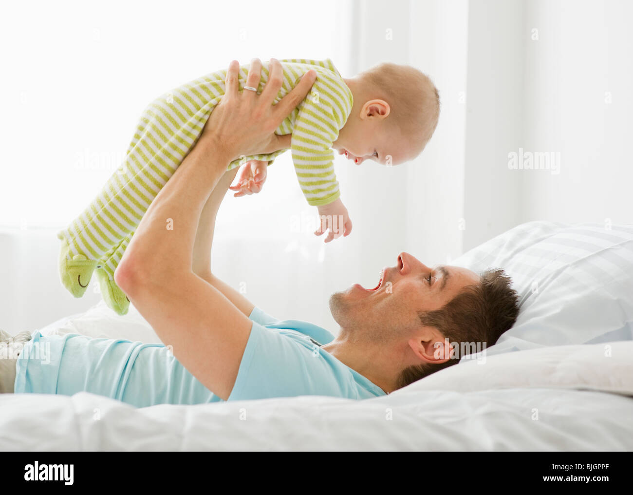 Father and baby playing Stock Photo - Alamy