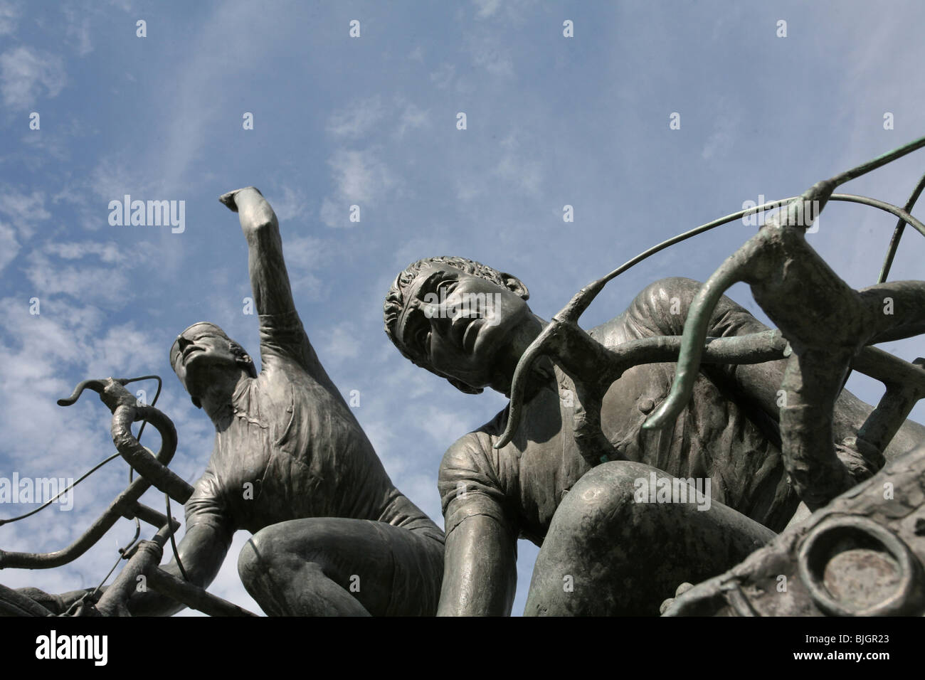 Picture of two bronze statues of cyclists, signifying Victory and ...