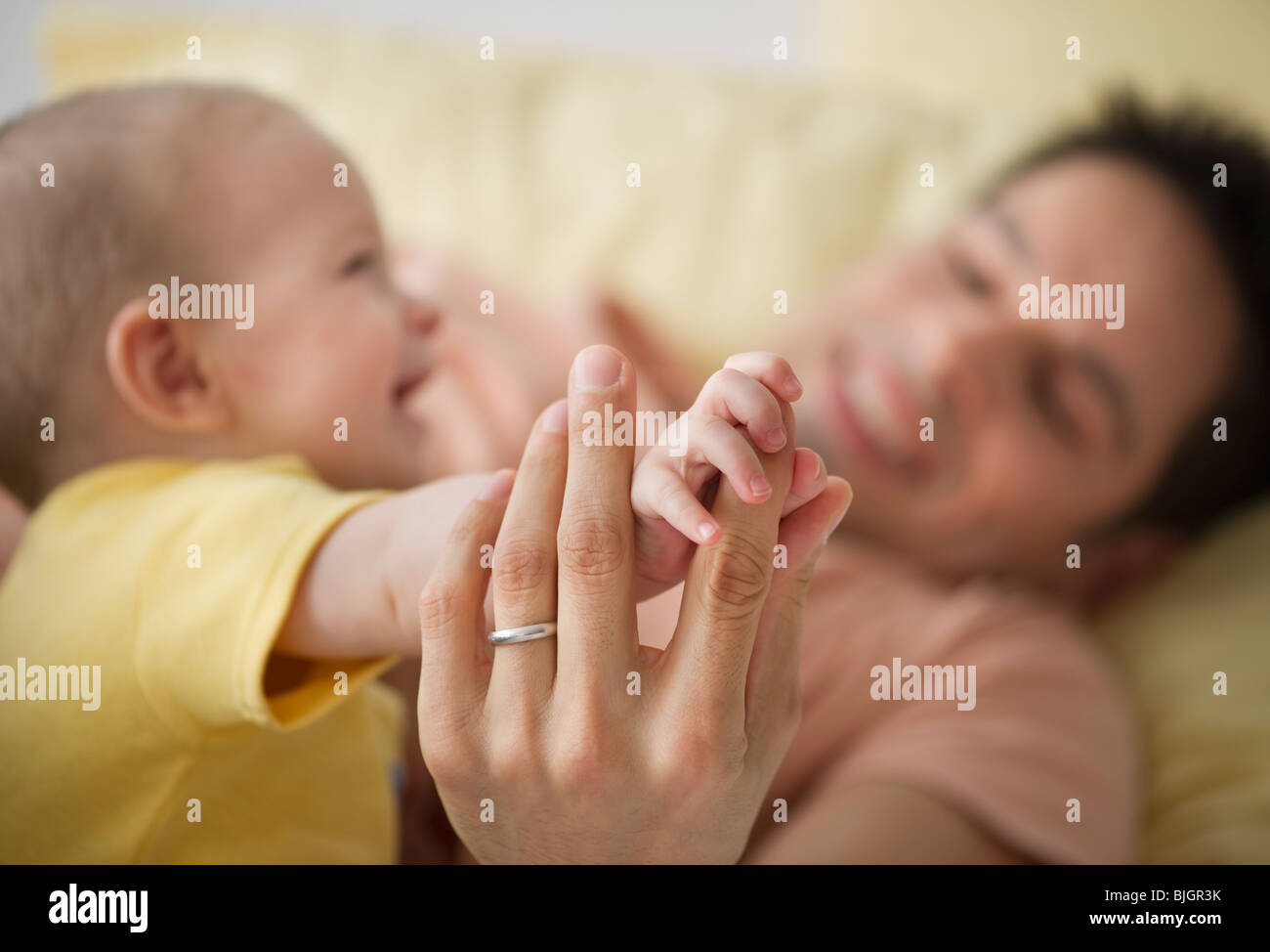 Father and baby playing Stock Photo - Alamy