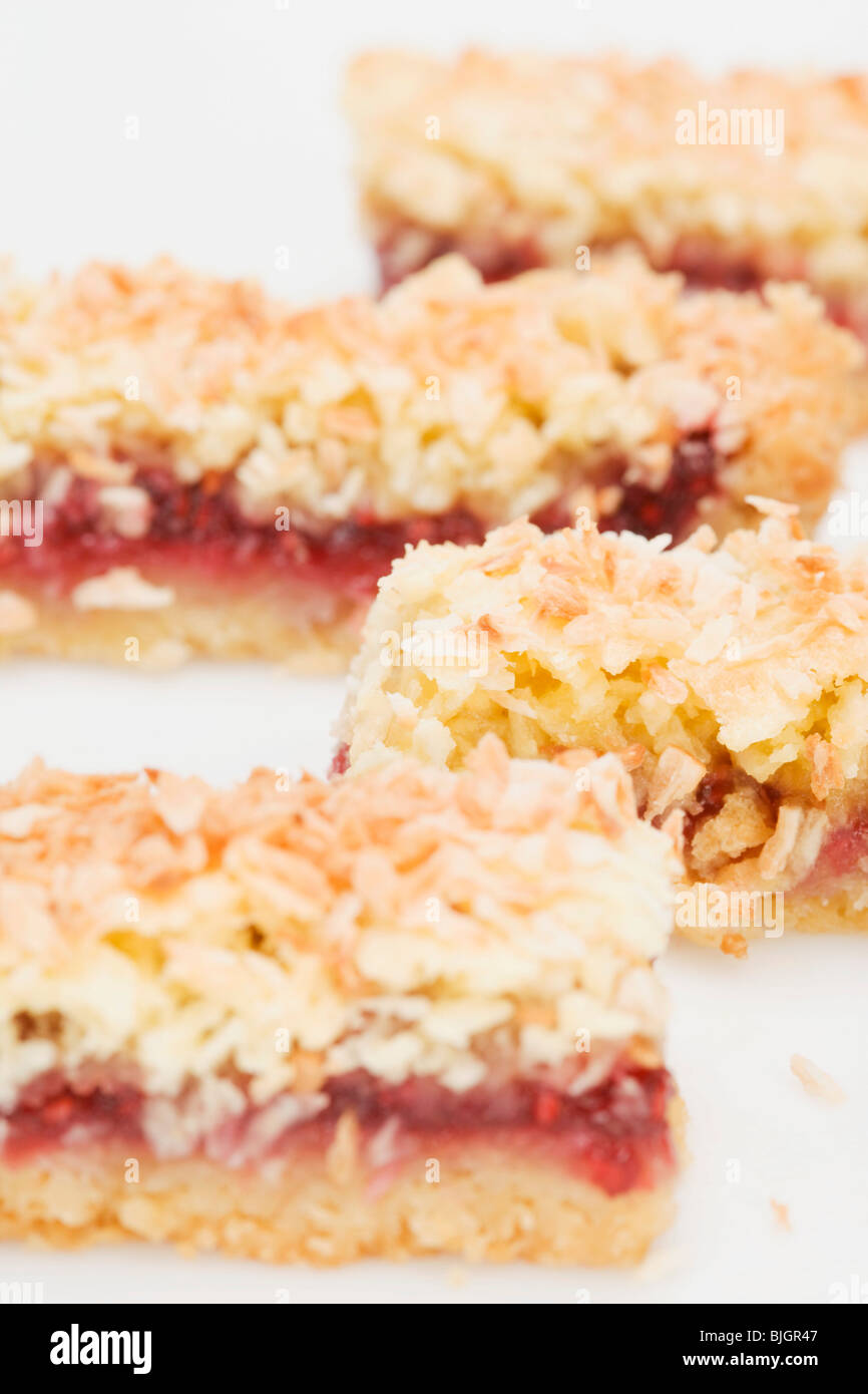Coconut slices with raspberry jam filling Stock Photo - Alamy