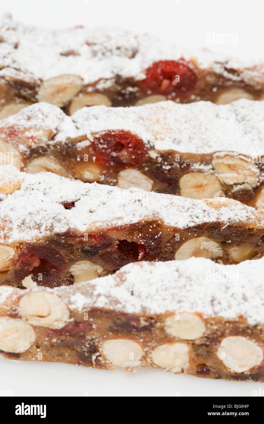 Panforte (Italian fruit cake) with icing sugar Stock Photo - Alamy
