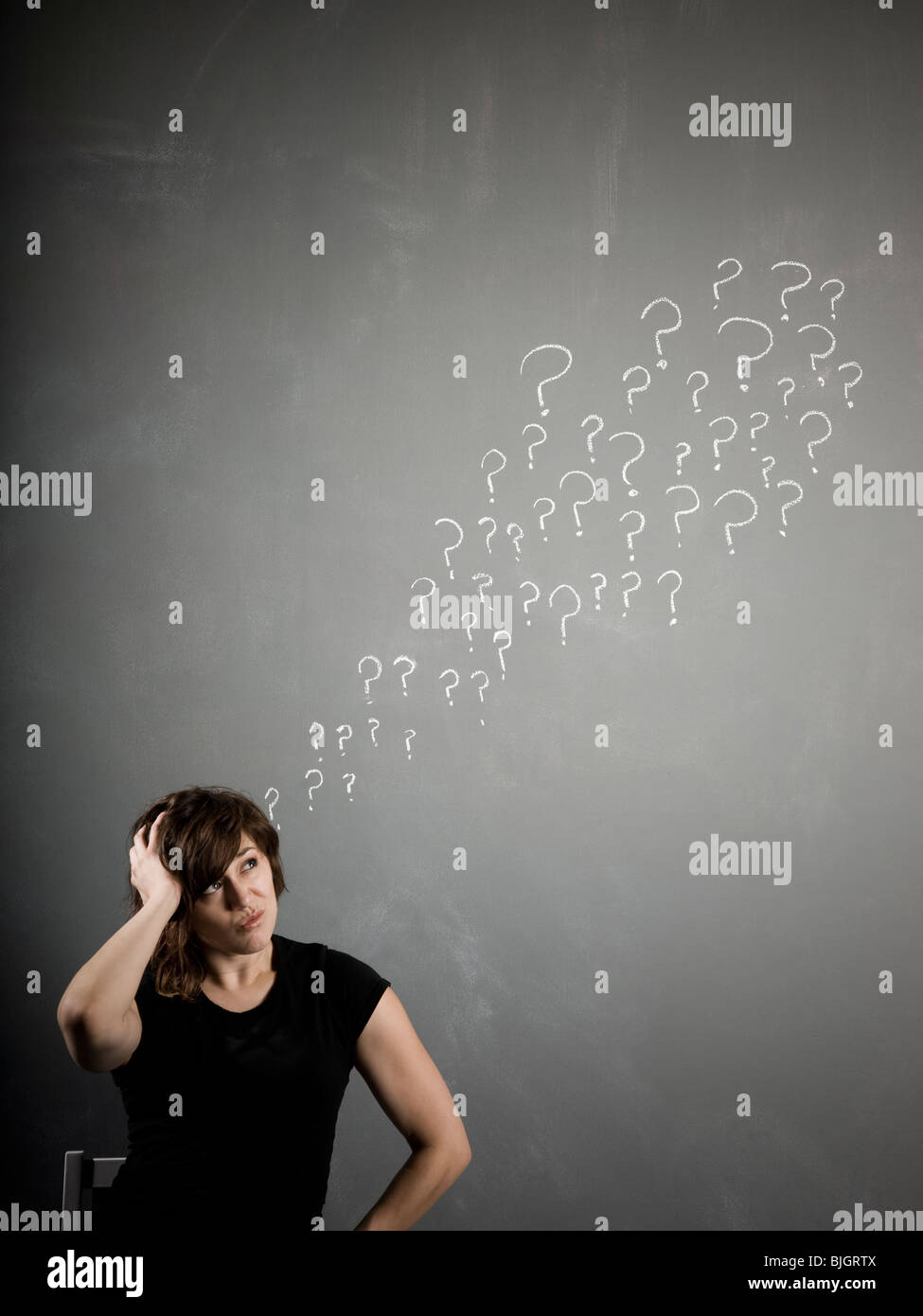 Woman question marks head hi-res stock photography and images - Alamy
