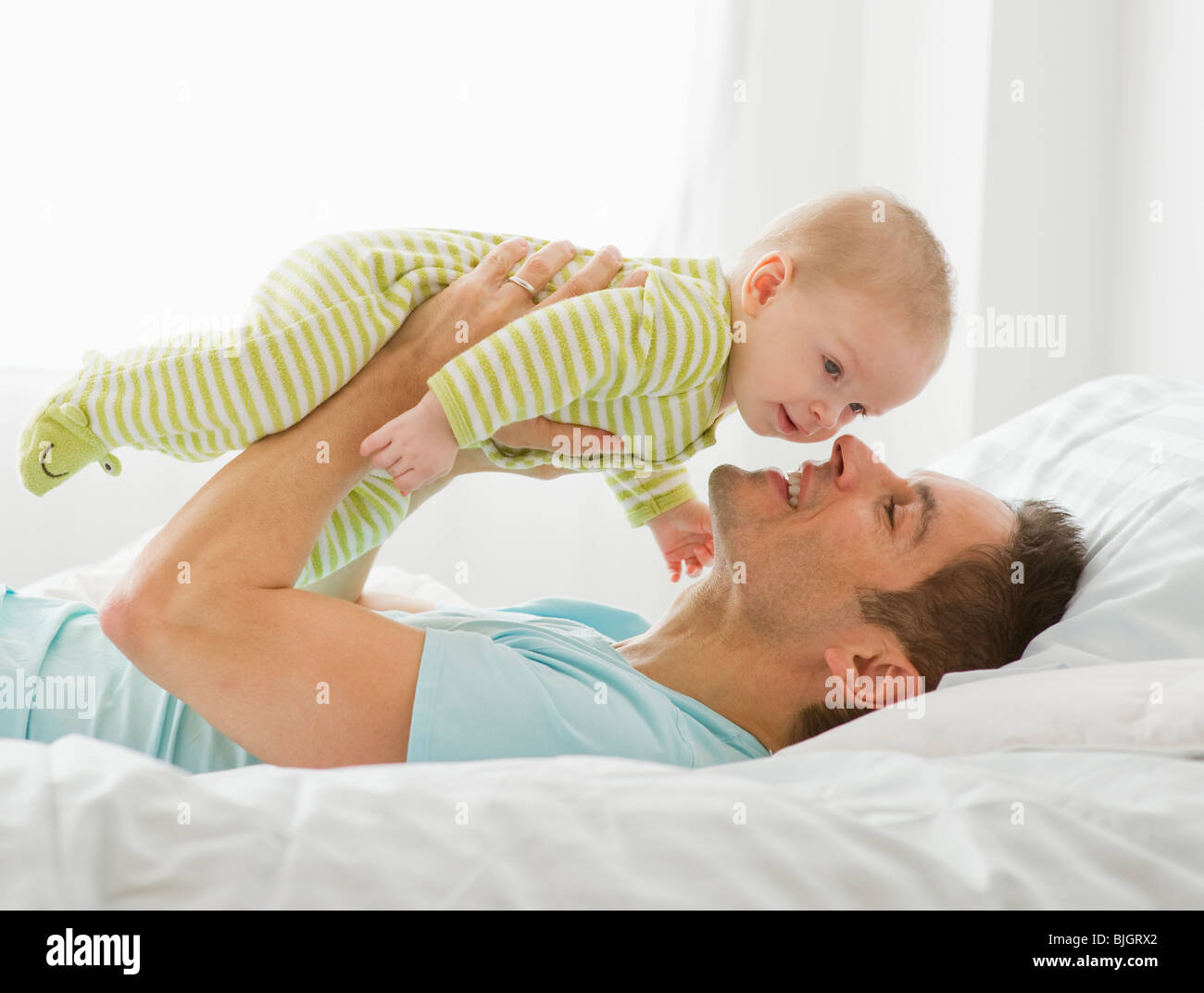 Father and baby playing Stock Photo - Alamy