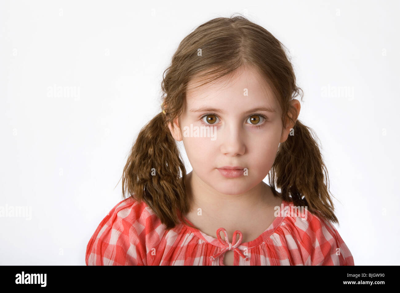 Young girl staring straight at the camera Stock Photo - Alamy