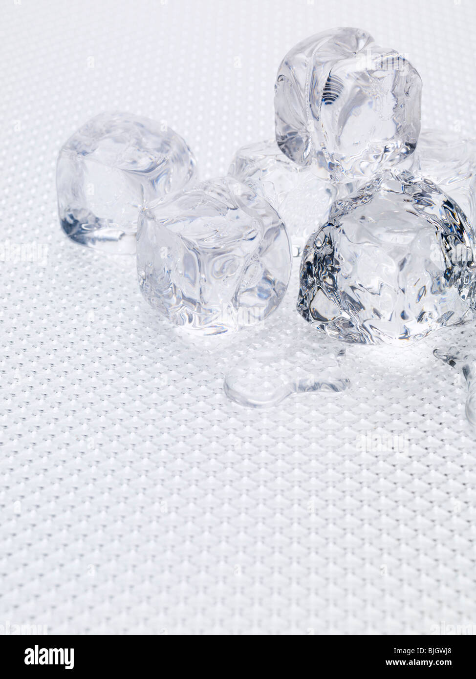 Five melting ice cubes Stock Photo - Alamy