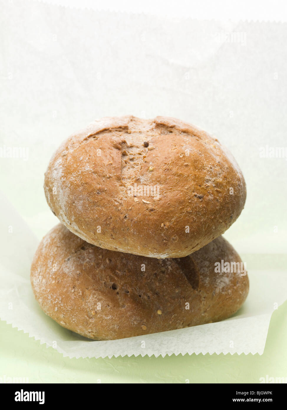 Two crusty brown rye rolls Stock Photo - Alamy