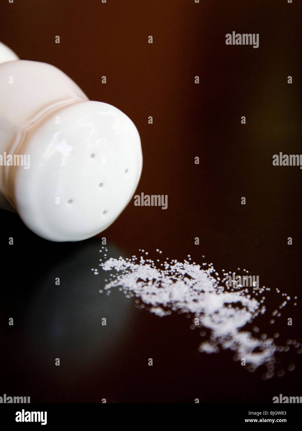 spilled salt shaker Stock Photo - Alamy