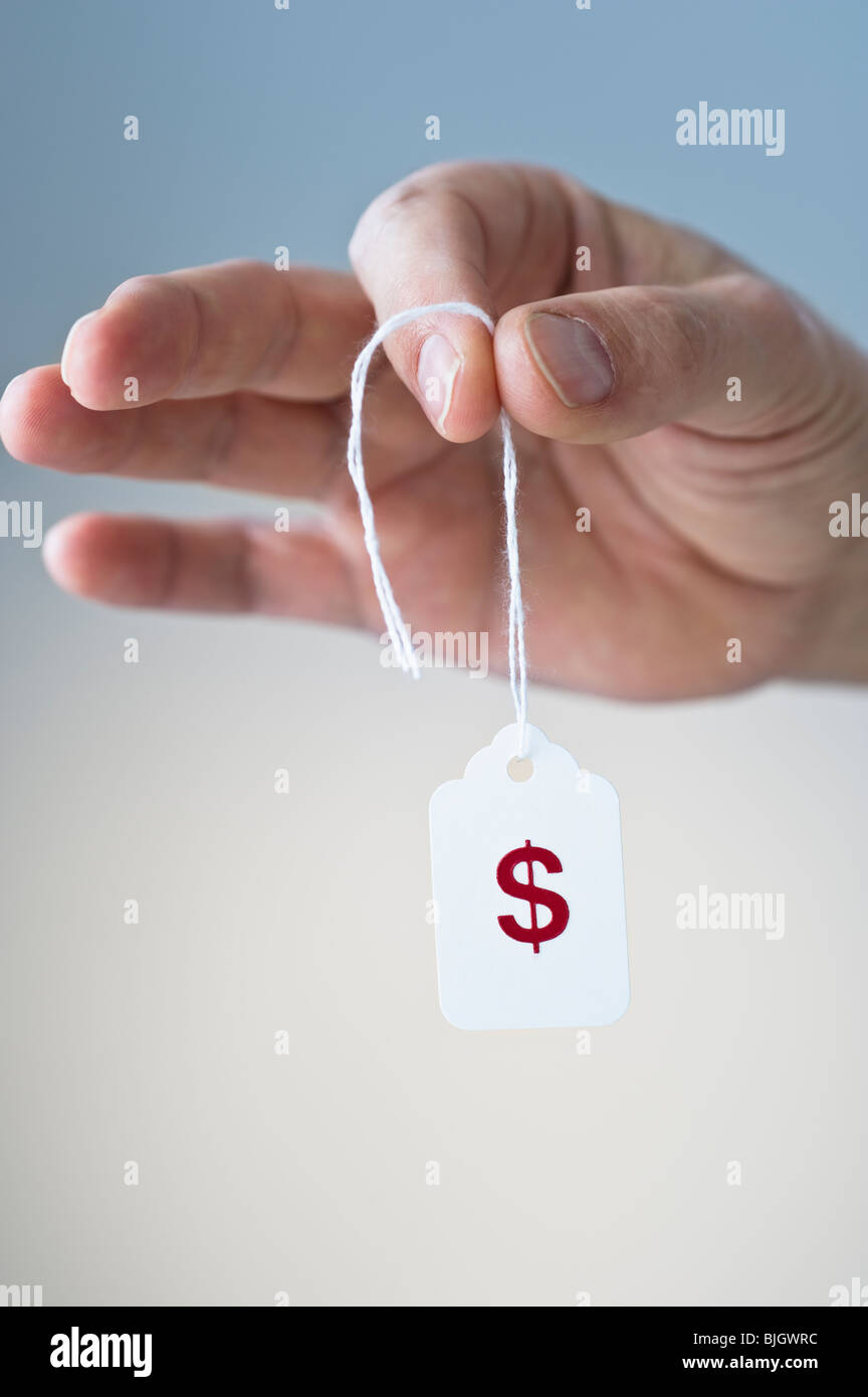 Hand holding tag hi-res stock photography and images - Alamy