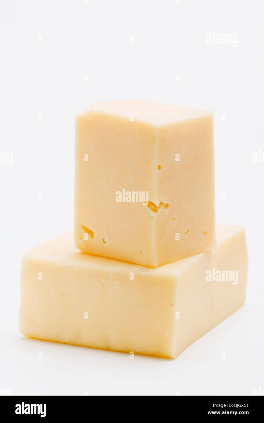 Two pieces of Cheddar cheese Stock Photo - Alamy