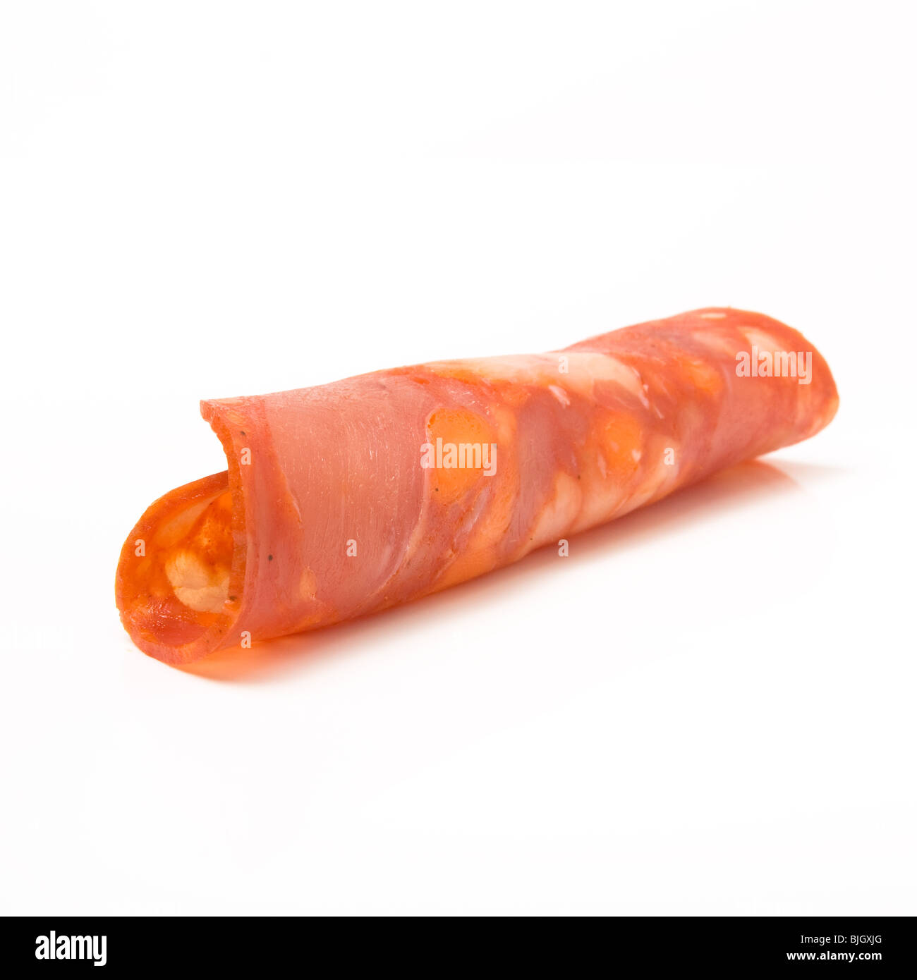 Rolled Chorizo Slices isolated against white background Stock Photo - Alamy