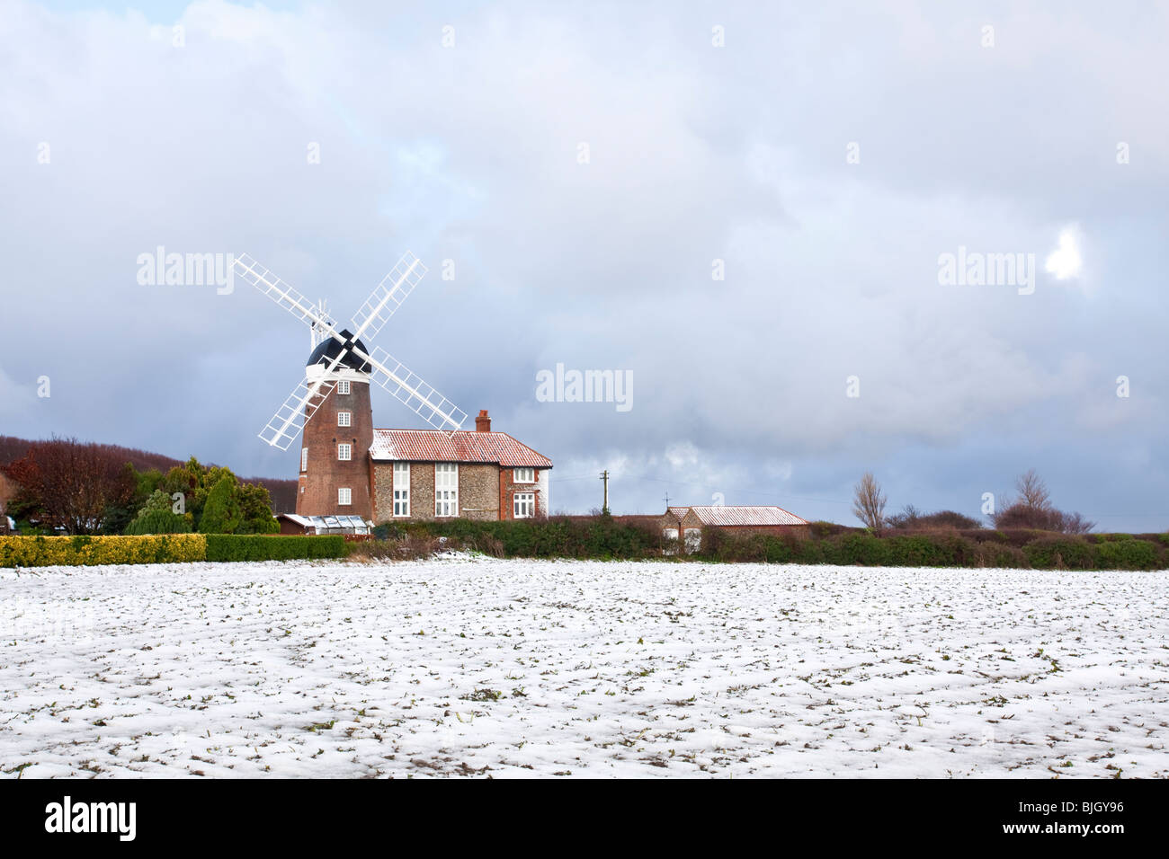 Weybourne windmill in Norfolk following winter snow showers Stock Photo ...