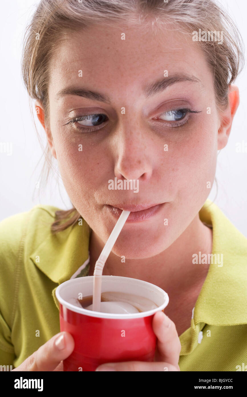 Woman drinking cola with straw hi-res stock photography and images - Alamy