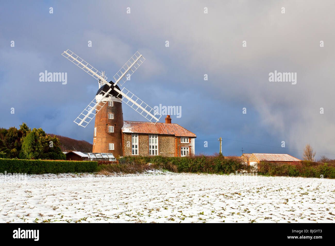 Weybourne windmill in Norfolk following winter snow showers Stock Photo ...