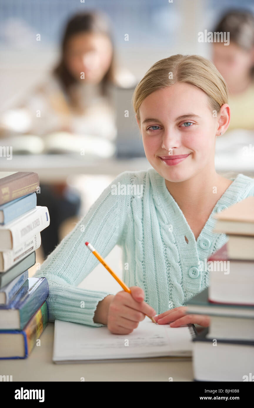 Smiling pre teen girl writing hi-res stock photography and images - Alamy