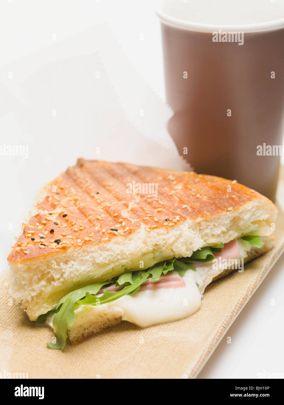 Cheese, ham and rocket in flatbread Stock Photo - Alamy