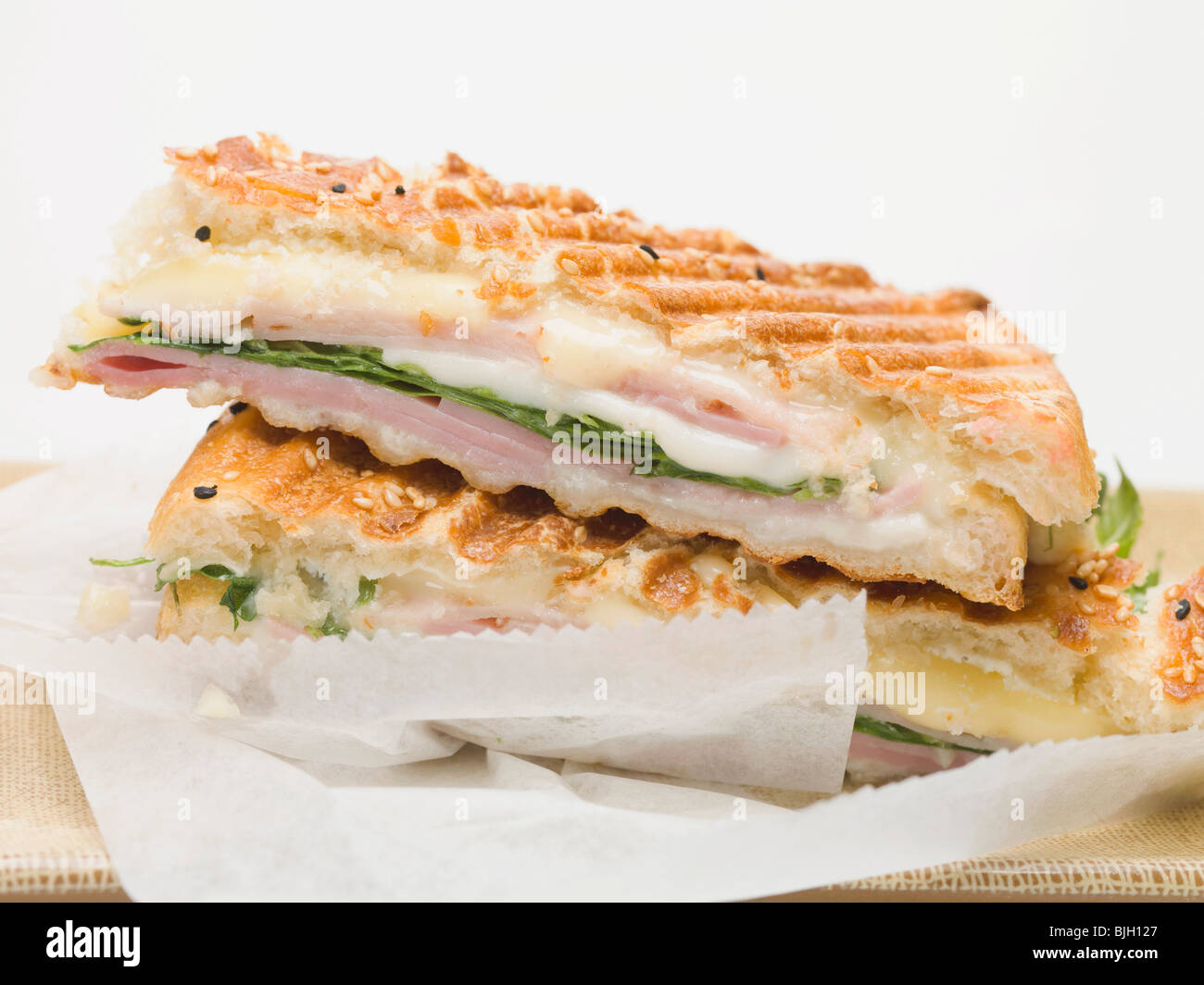 Toasted flatbread with cheese and ham filling Stock Photo - Alamy