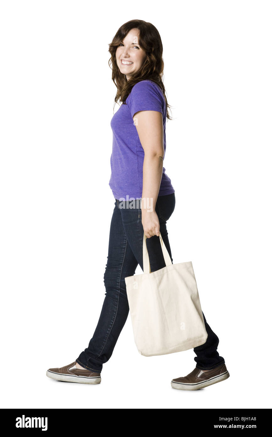 woman carrying a bag Stock Photo - Alamy