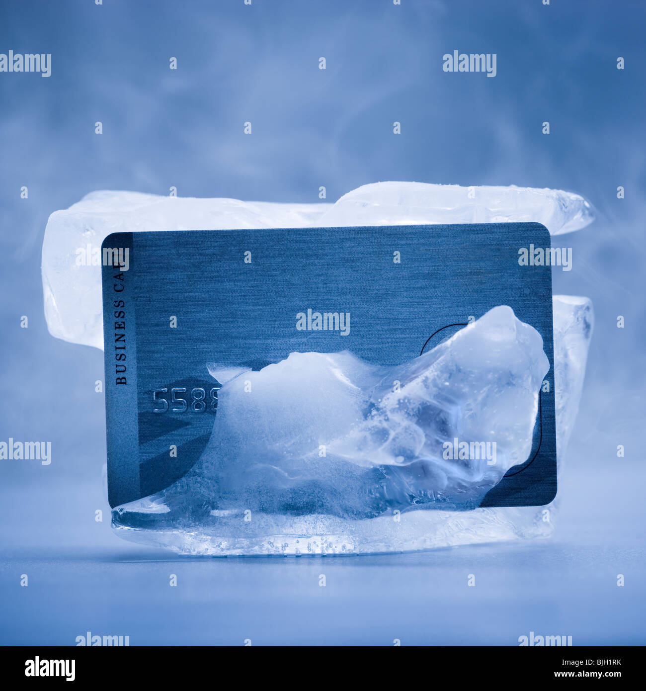 credit card frozen in ice Stock Photo - Alamy