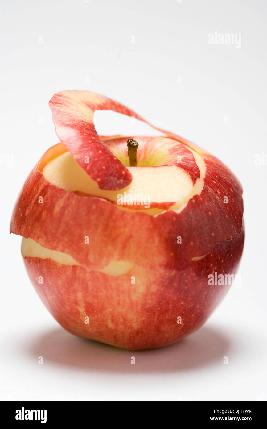 Gala apple, partly peeled Stock Photo - Alamy