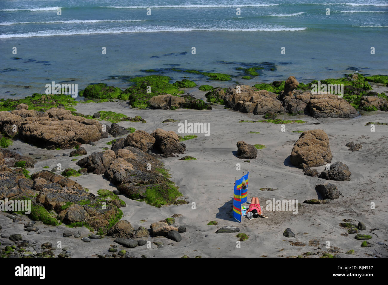 Woman sunbathing at beach uk hi-res stock photography and images - Alamy