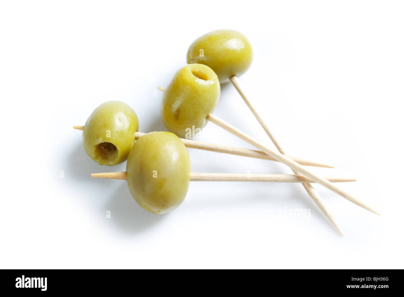 green olives and toothpick Stock Photo - Alamy