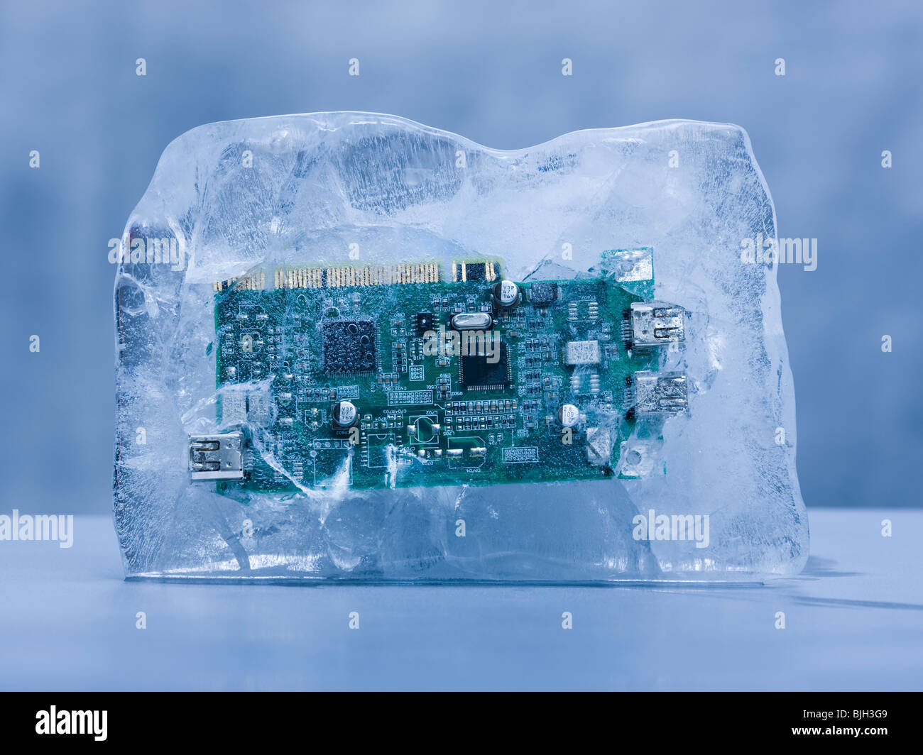 computer chip frozen in a block of solid ice Stock Photo - Alamy
