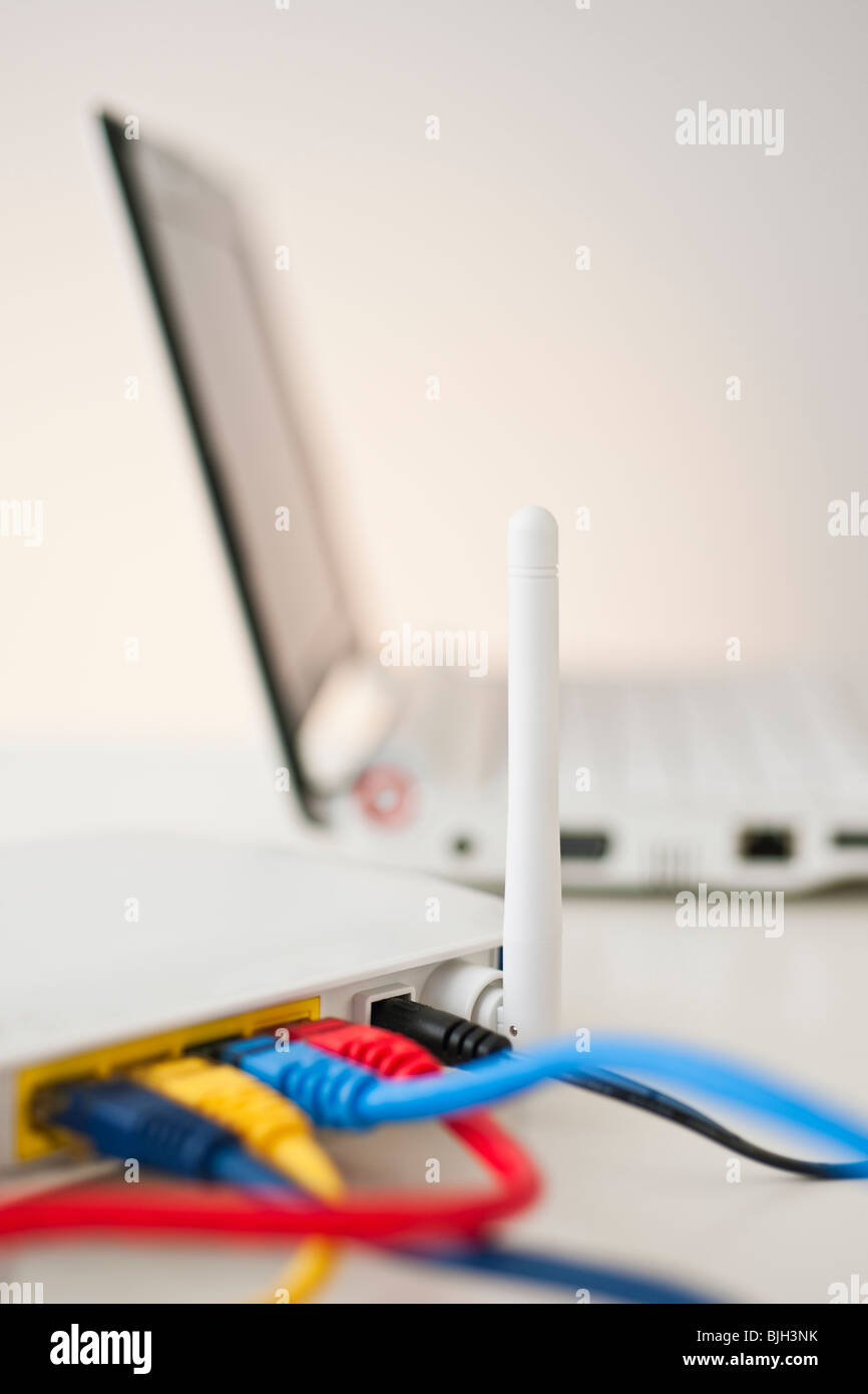 The internet cable plugs are connected to the internet router hi-res ...