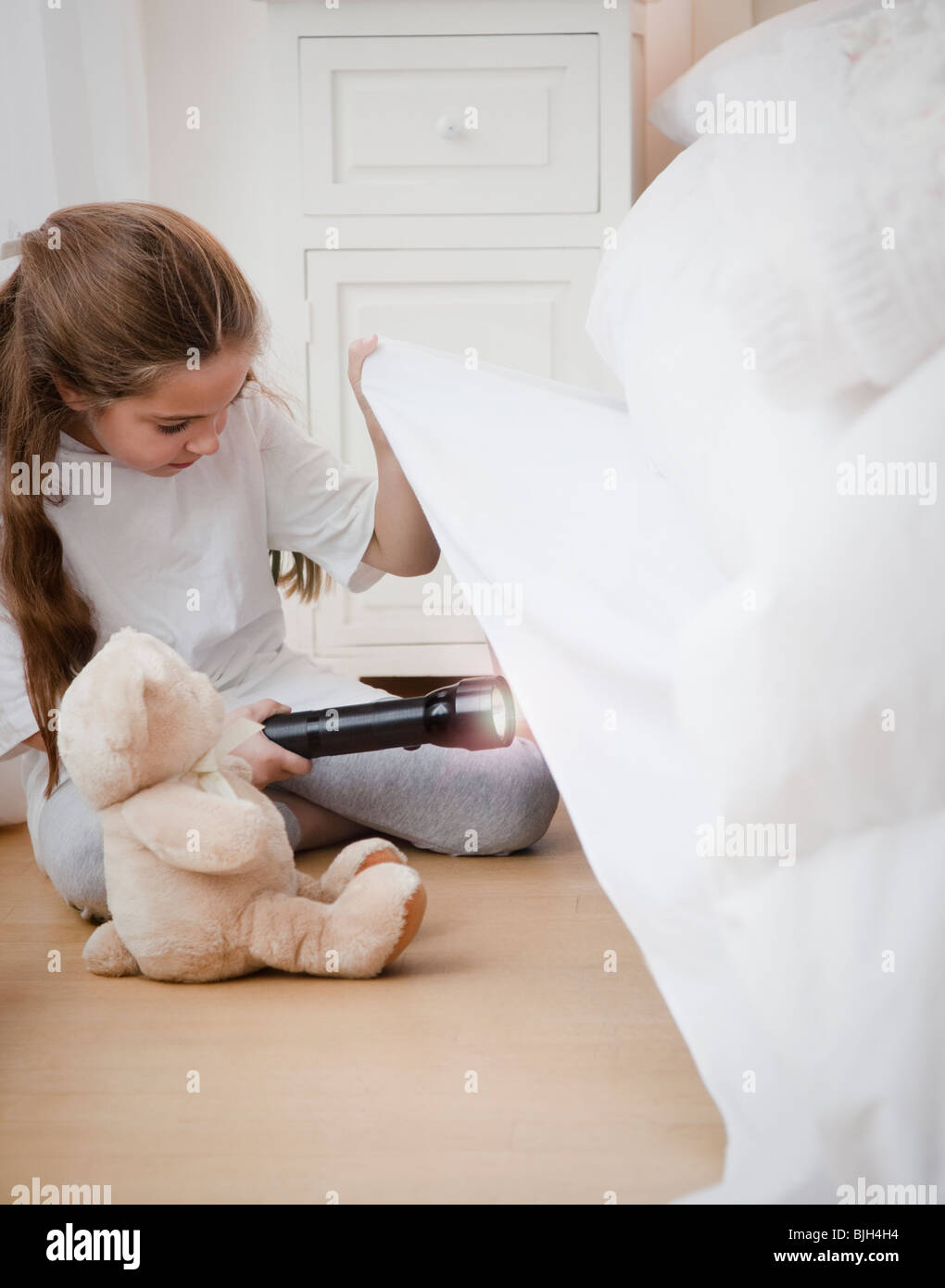 Little Girl Looking Under Bed