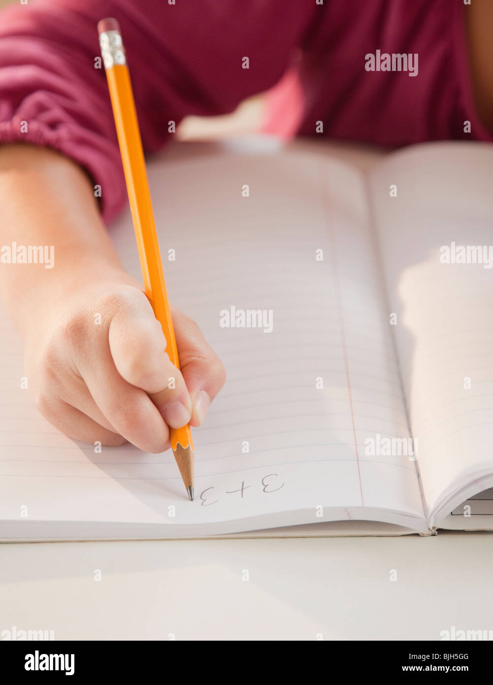 Young girl doing math homework Stock Photo - Alamy