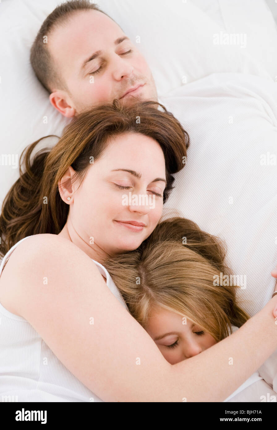 Husband And Wife Sleeping Together