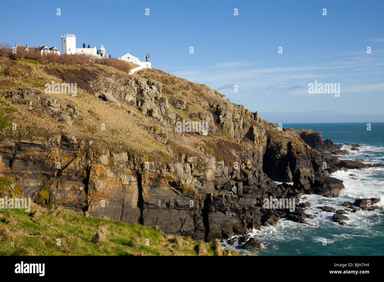 Coastline at the Lizard Cornwall with the Lizard lighthouse on top the ...