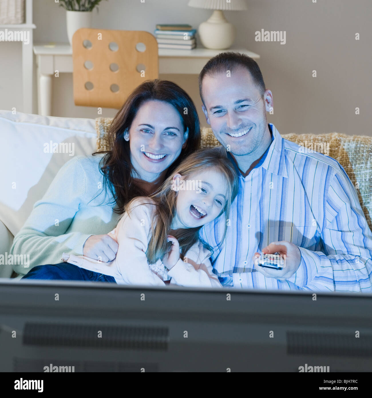 Family watching television Stock Photo - Alamy