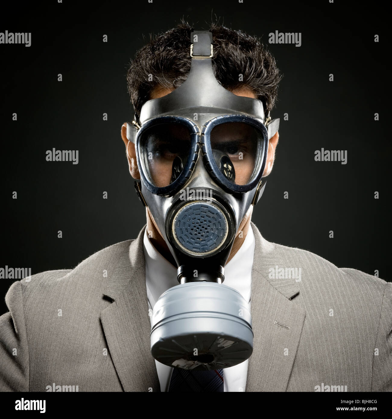 businessman wearing a gas mask Stock Photo - Alamy