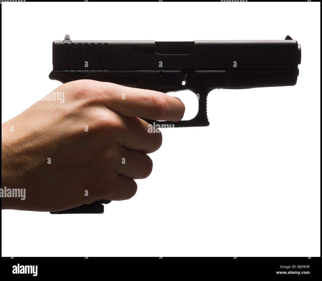hand holding a gun Stock Photo - Alamy