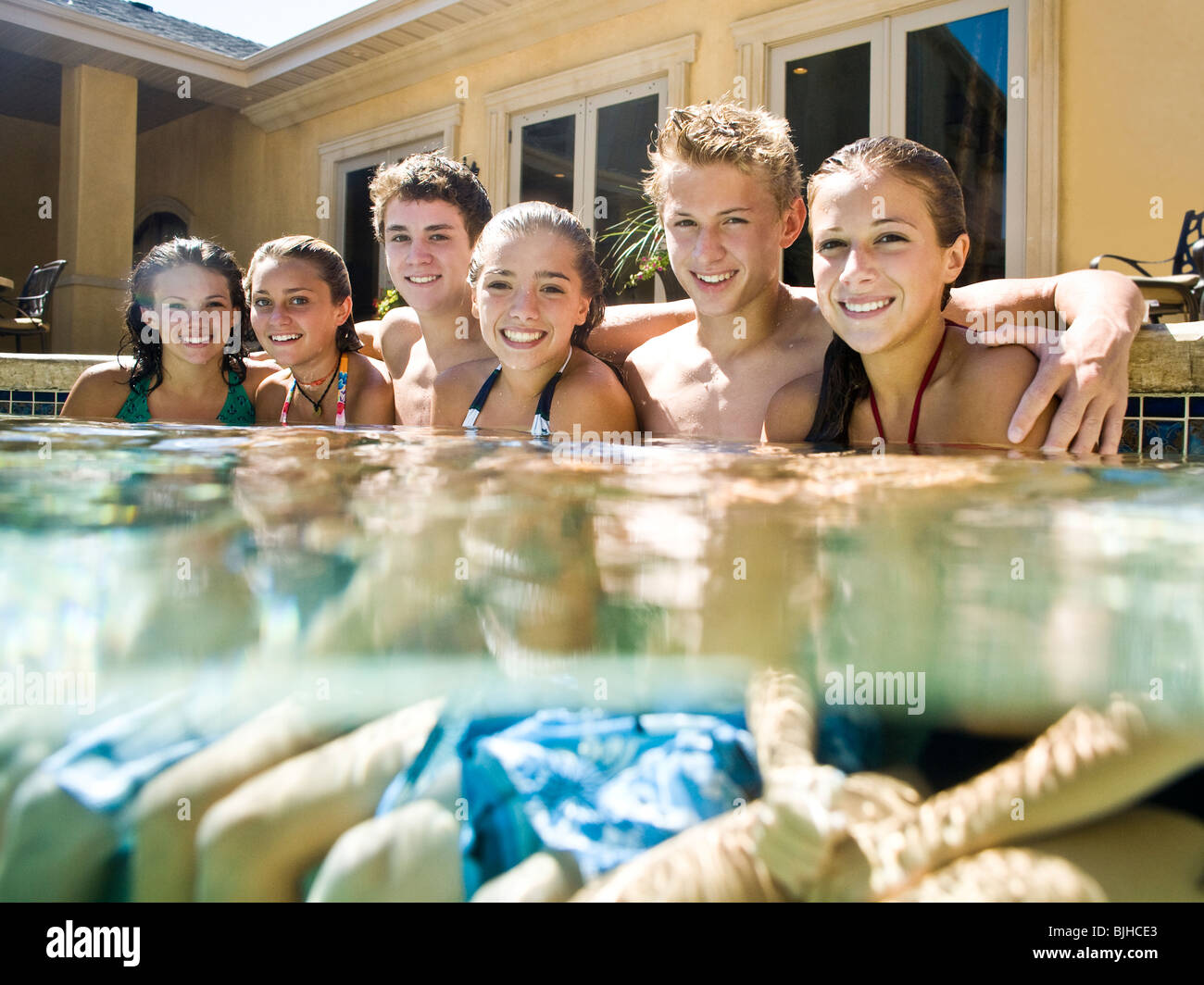 teenagers in a swimming pool Stock Photo - Alamy