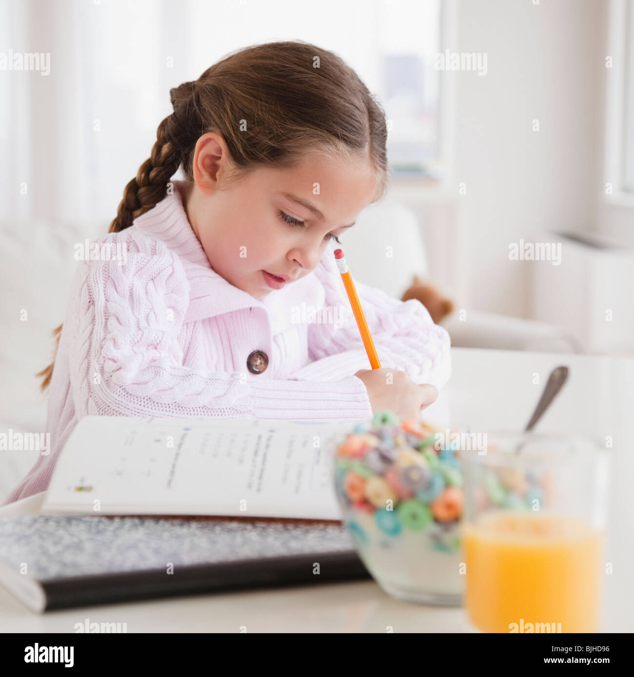 Young girl doing her homework Stock Photo - Alamy