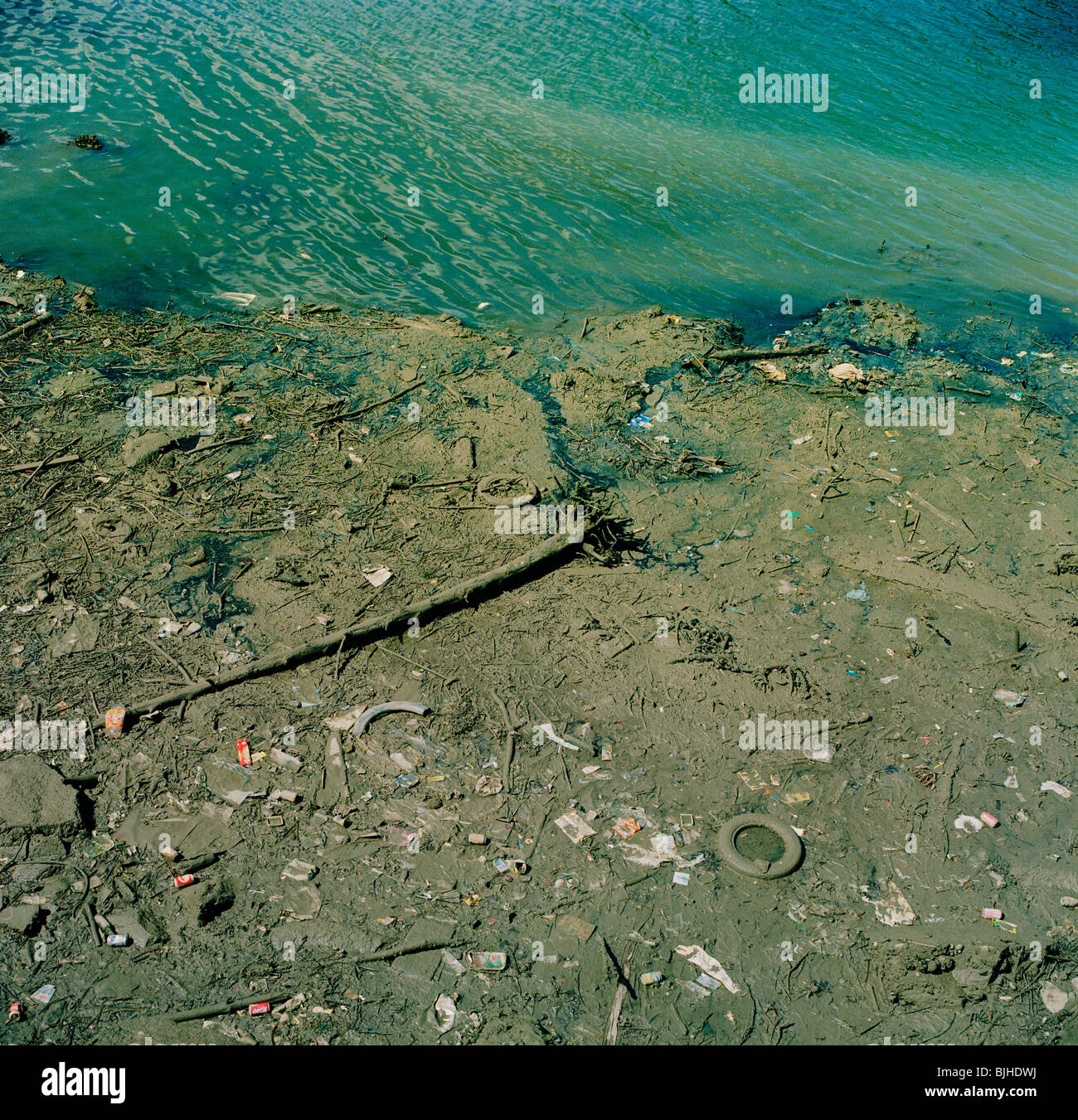 pollution and debris on river bank Stock Photo - Alamy